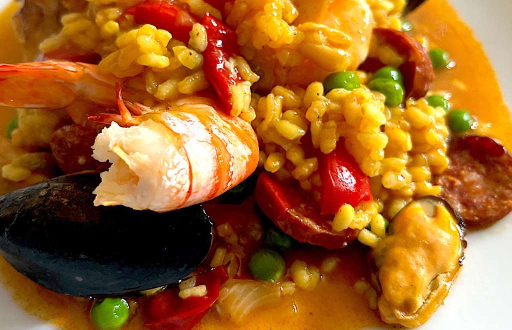 Spanish Paella: A Festive Fusion of Land and Sea Flavors - Recipes ...